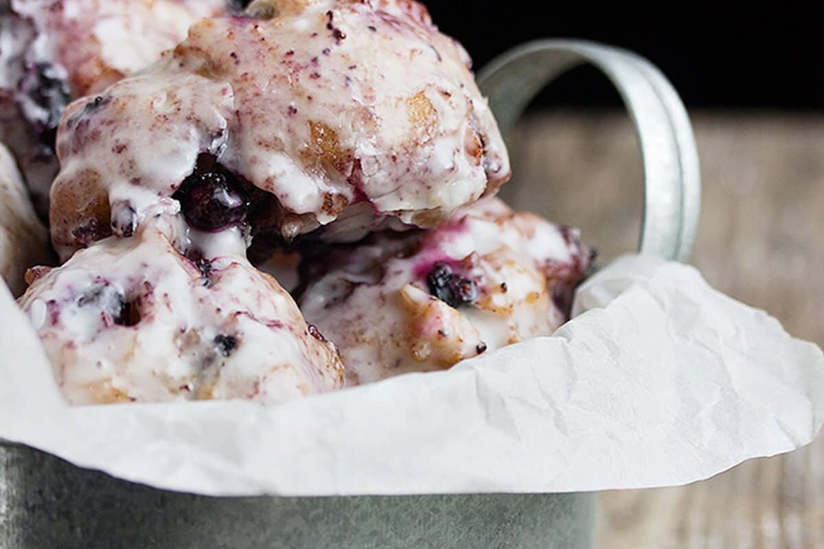 Glazed Fresh Blueberry Fritters - Seasons and Suppers