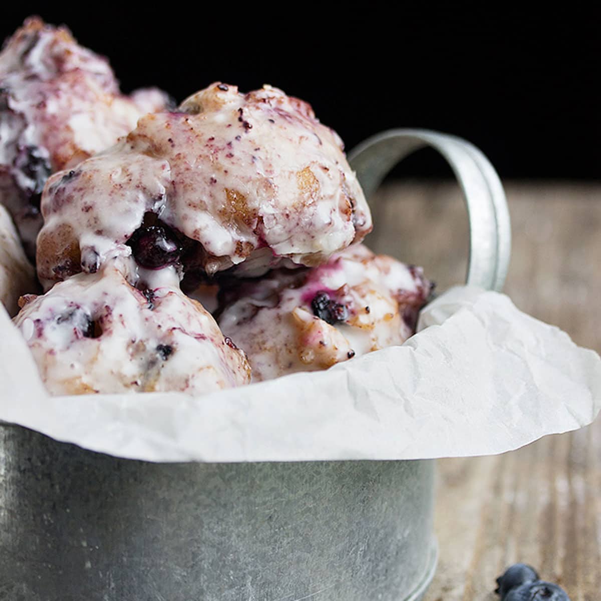 Glazed Fresh Blueberry Fritters - Seasons and Suppers