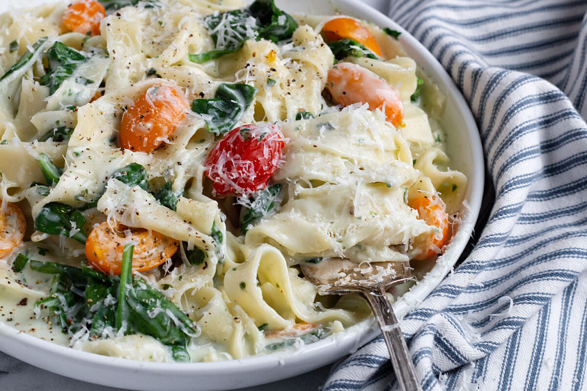 Goat Cheese Pasta with Spinach and Tomatoes - Seasons and Suppers