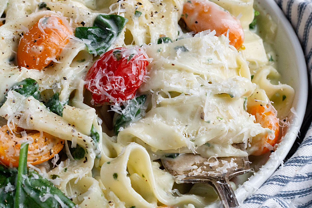 Goat Cheese Pasta with Spinach and Tomatoes - Seasons and Suppers